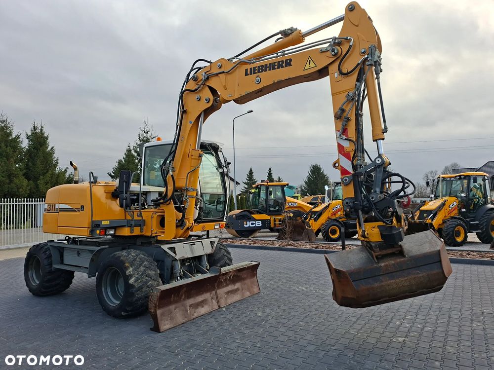 Używany Liebherr A311 ROTOTILT 2010 - 185 000 PLN - Otomoto.pl